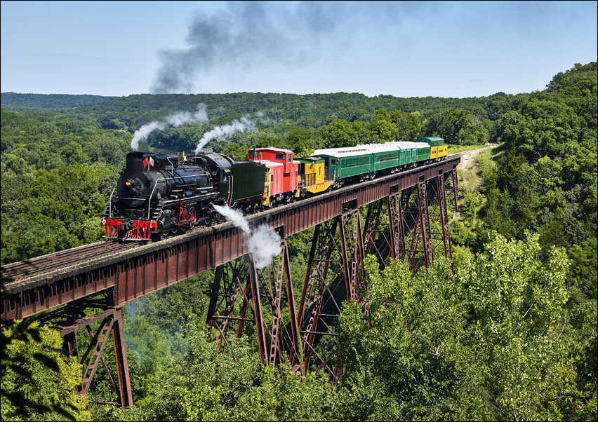 A steam train crosses the 156-foot-tall Bass Point Creek Bridge., Carol ...