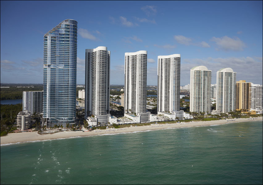 Aerial view of Miami Beach, a bony-finger-like barrier island separated ...