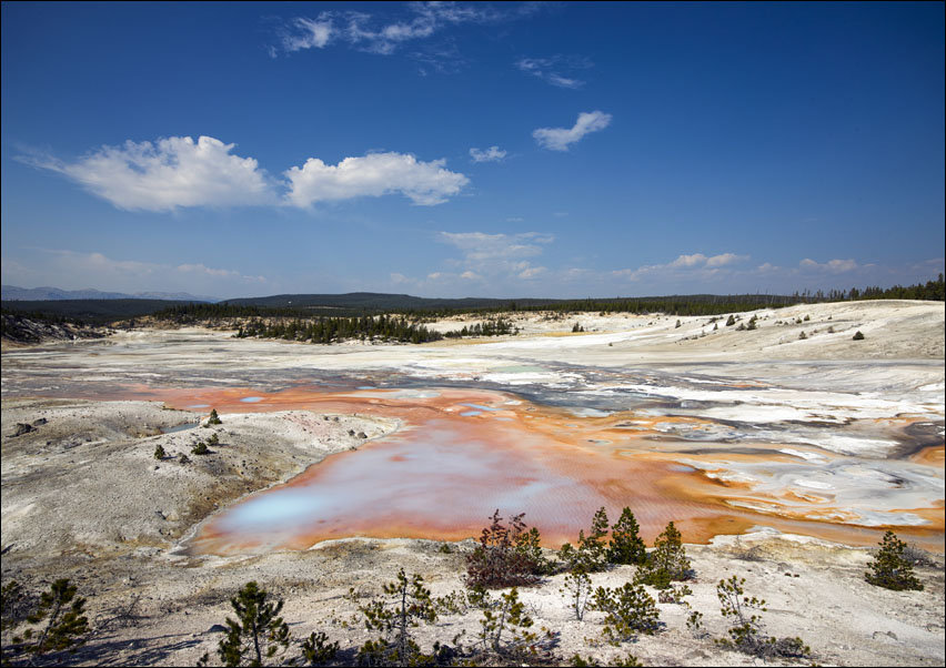 Mudpots and hot springs color the terrain in northwestern Wyoming’s ...